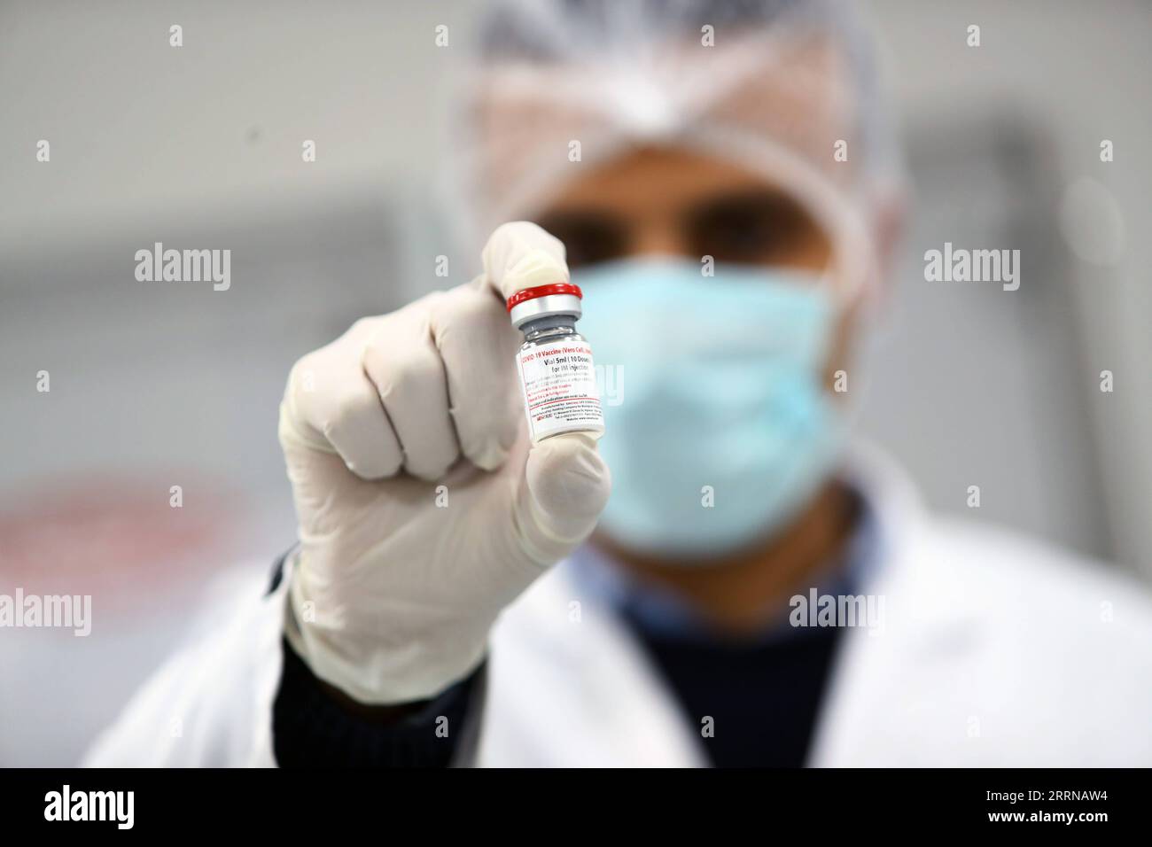 221230 -- BEIJING, Dec. 30, 2022 -- A staff member shows a vial of ...