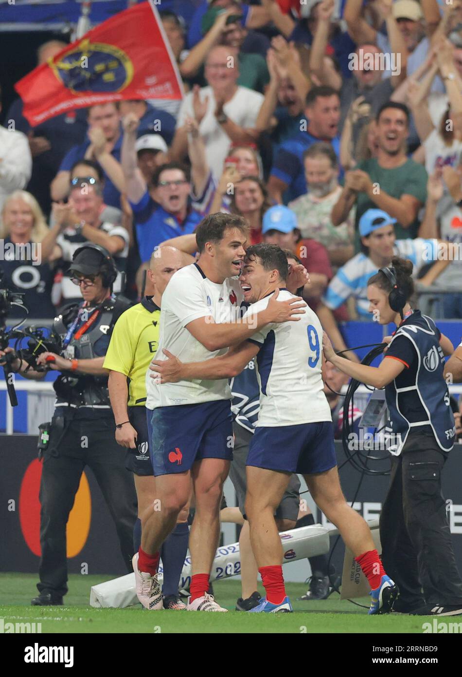 France's Damian Penaud (L) reacts after scoring a try during the second ...