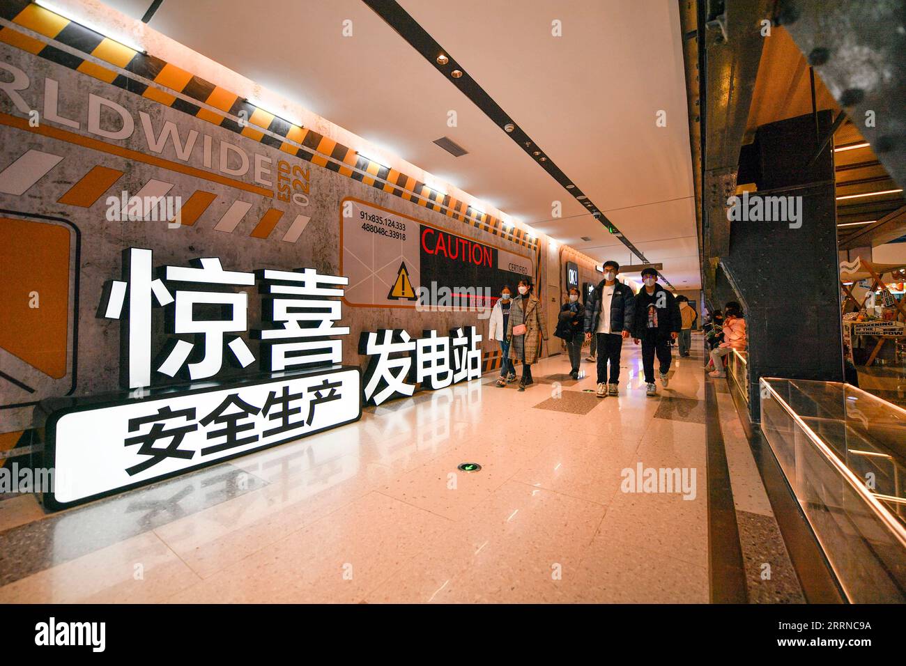 230102 -- TIANJIN, Jan. 2, 2023 -- People walk past a corridor ...