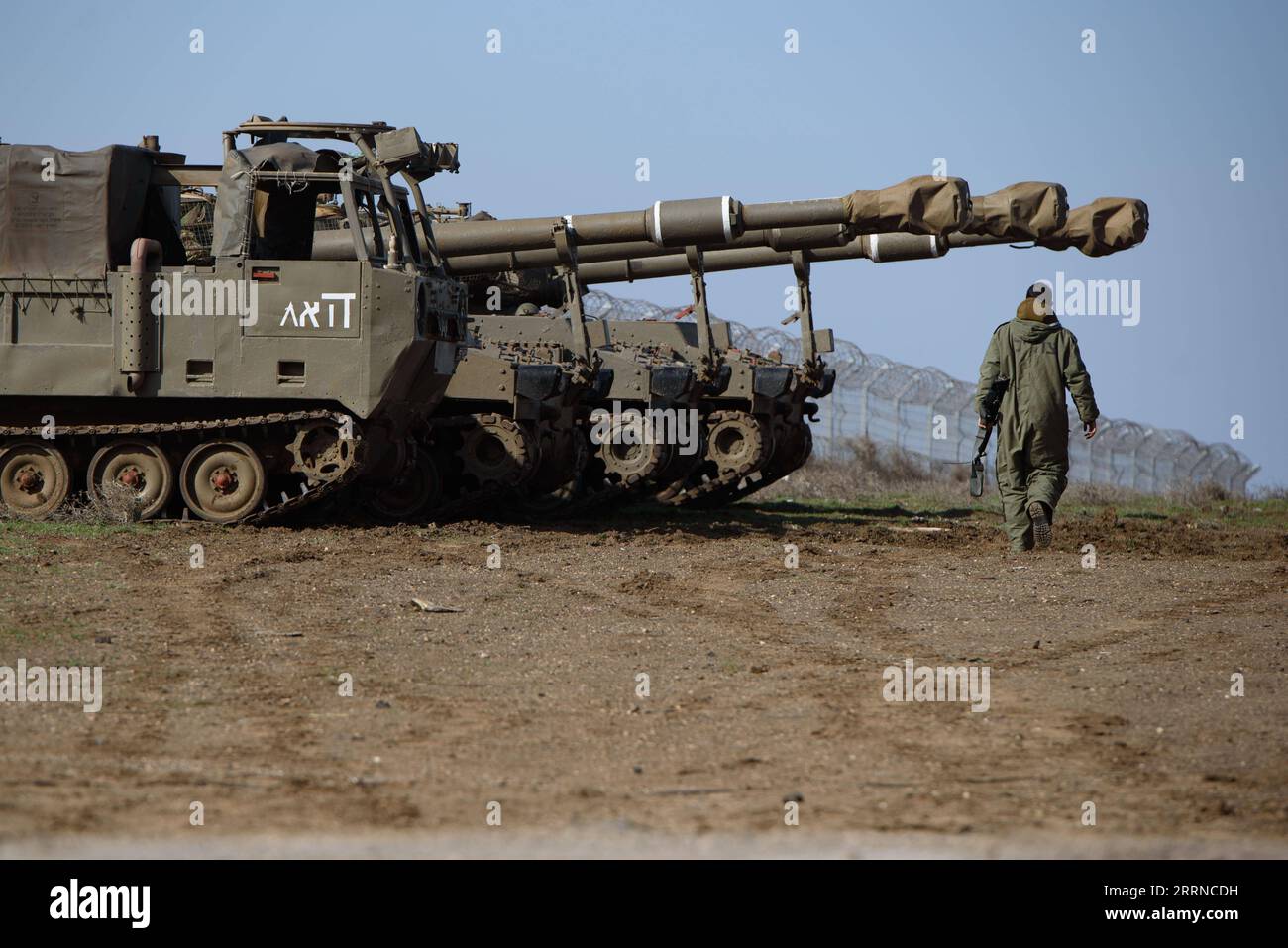 230102 -- GOLAN HEIGHTS, Jan. 2, 2023 -- An Israeli soldier walks past ...
