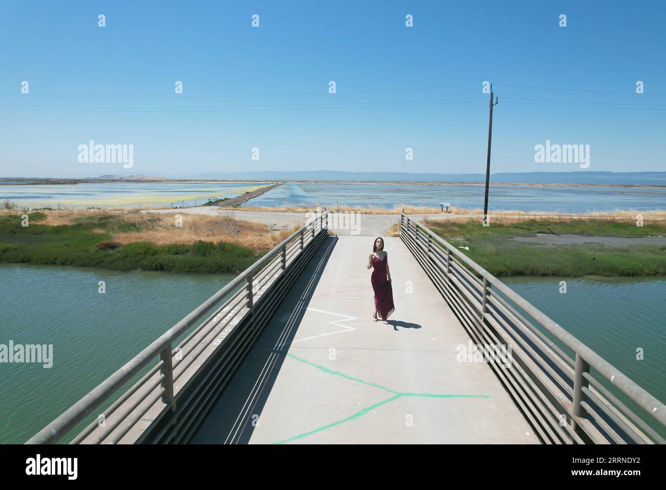 Photo of a beautiful Arab lady on a dock, on a river, photographed from ...