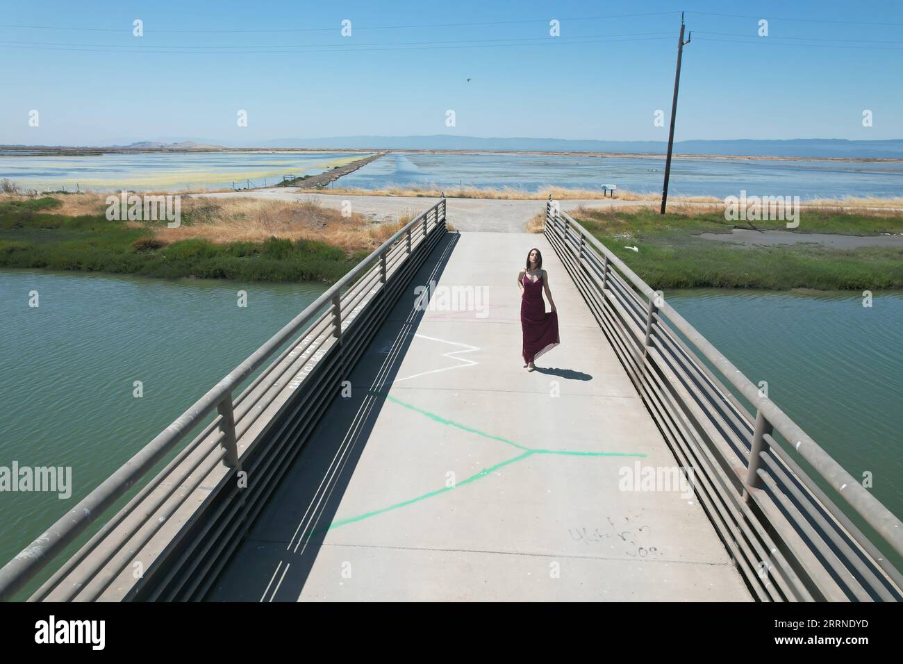 Photo of a beautiful Arab lady on a dock, on a river, photographed from ...