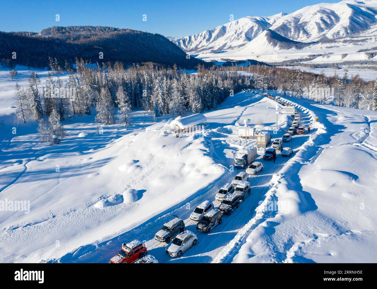 230113 -- ALTAY, Jan. 13, 2023 -- This aerial photo shows cars entering ...