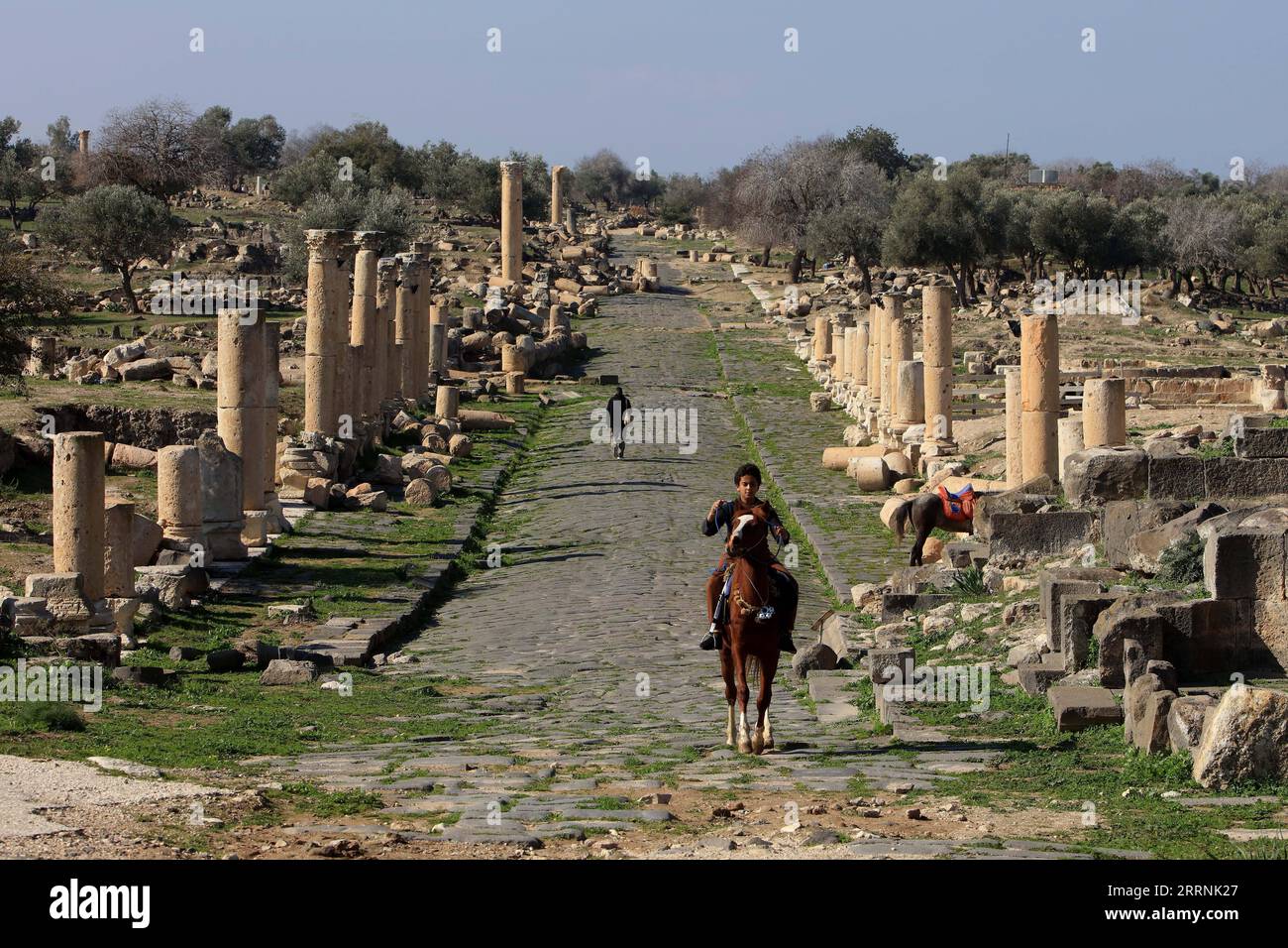 230118 -- UMM QAIS, Jan. 18, 2023 -- A boy rides a horse at an ...