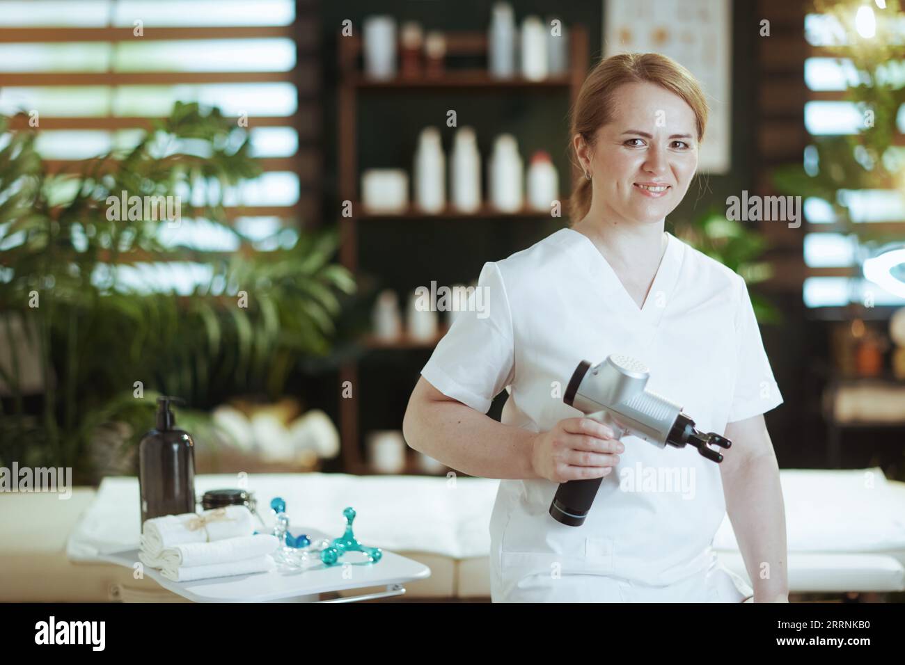 Healthcare Time Smiling Female Medical Massage Therapist In Massage