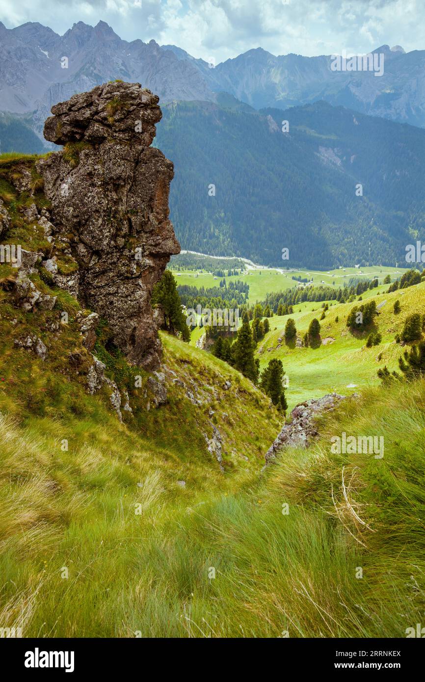 Summer time in Dolomites. landscape with mountains, hills, grass and ...