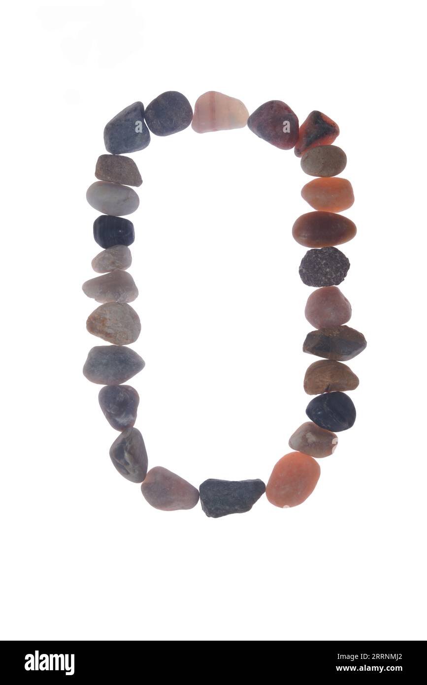 Letter O handcrafted using small stones or pebbles, single object ...