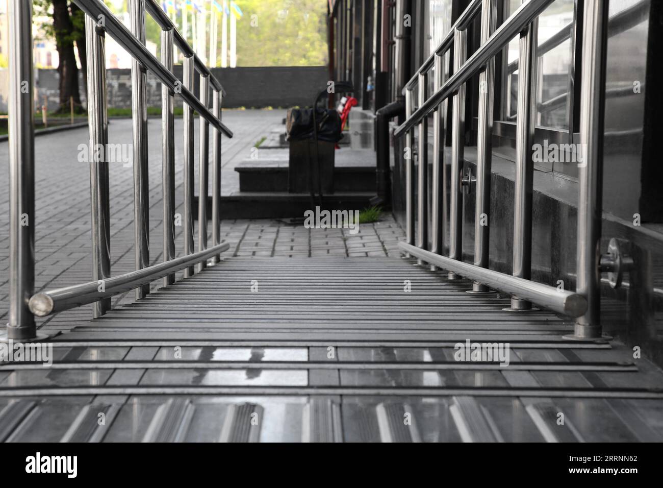 Ramp with metal railings near building outdoors Stock Photo - Alamy