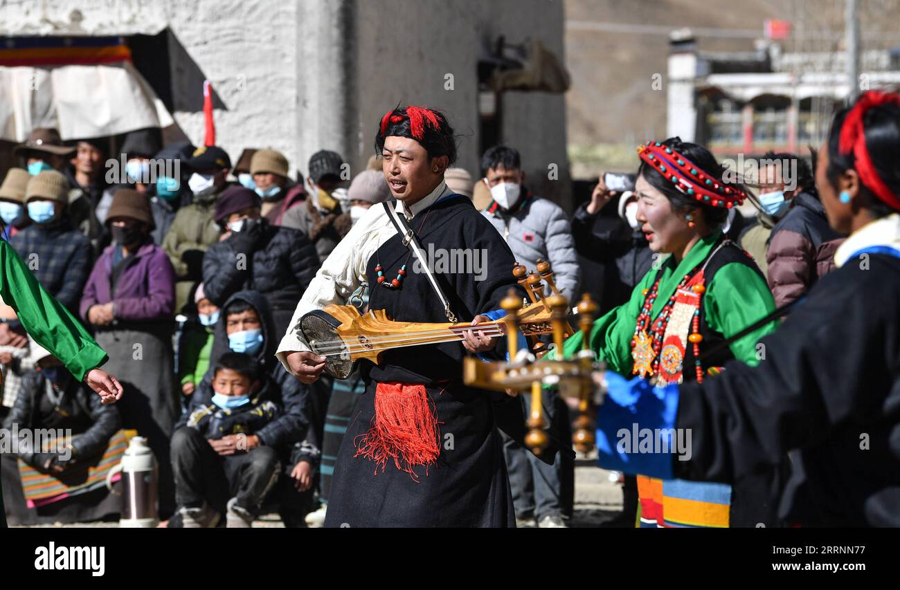 230122 -- LHASA, Jan. 22, 2023 -- Actors play musical instruments ...