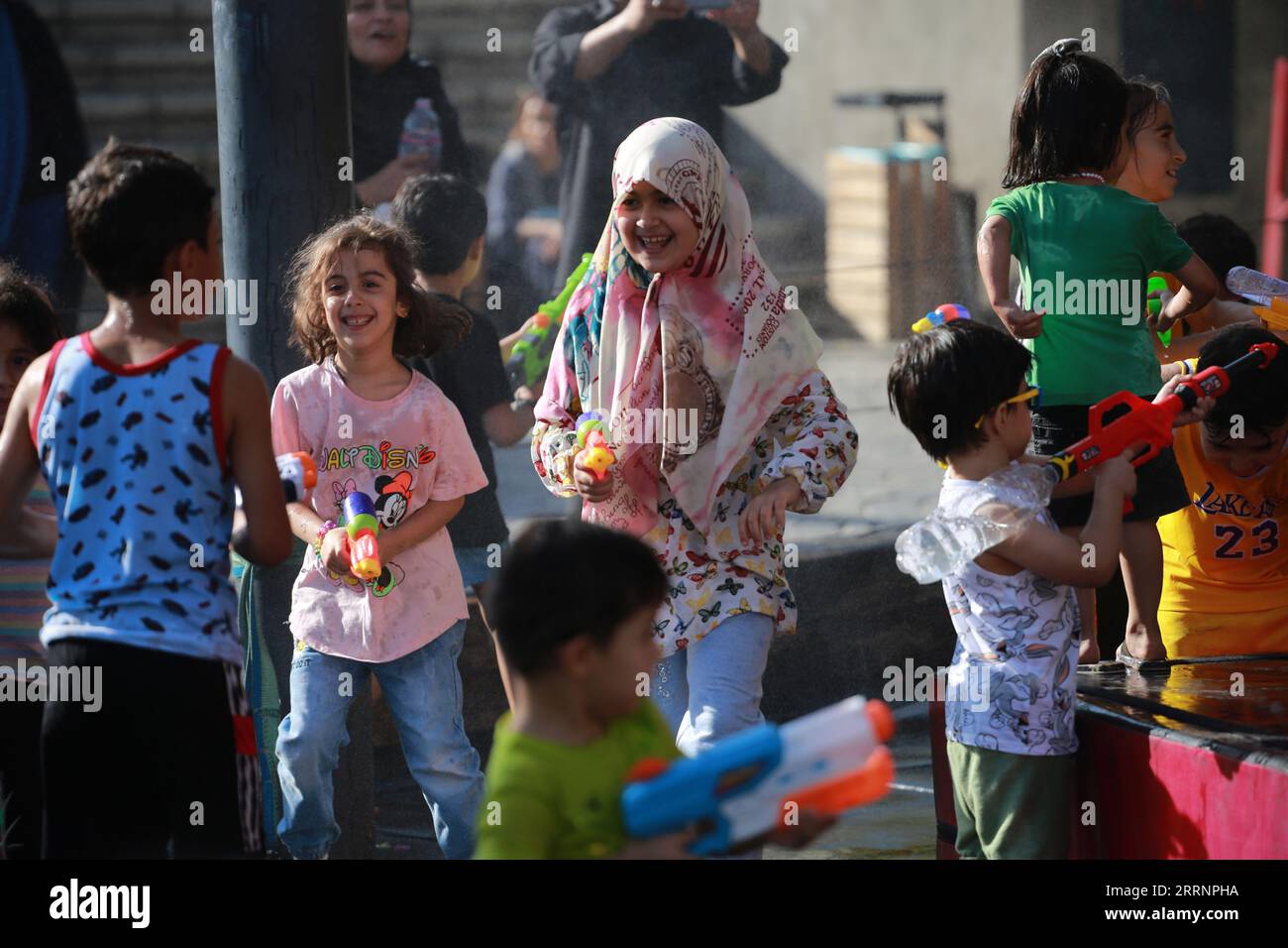 Tehran, Iran. 8th Sep, 2023. Children play with water guns as they take ...