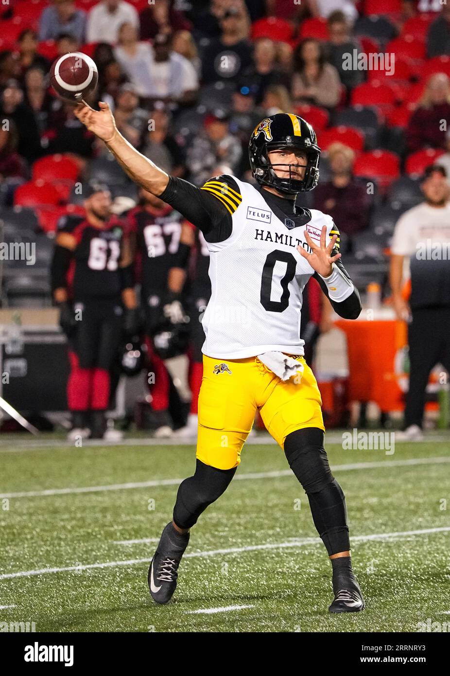 Hamilton Tiger-Cats' Taylor Powell passes against the Ottawa Redblacks ...