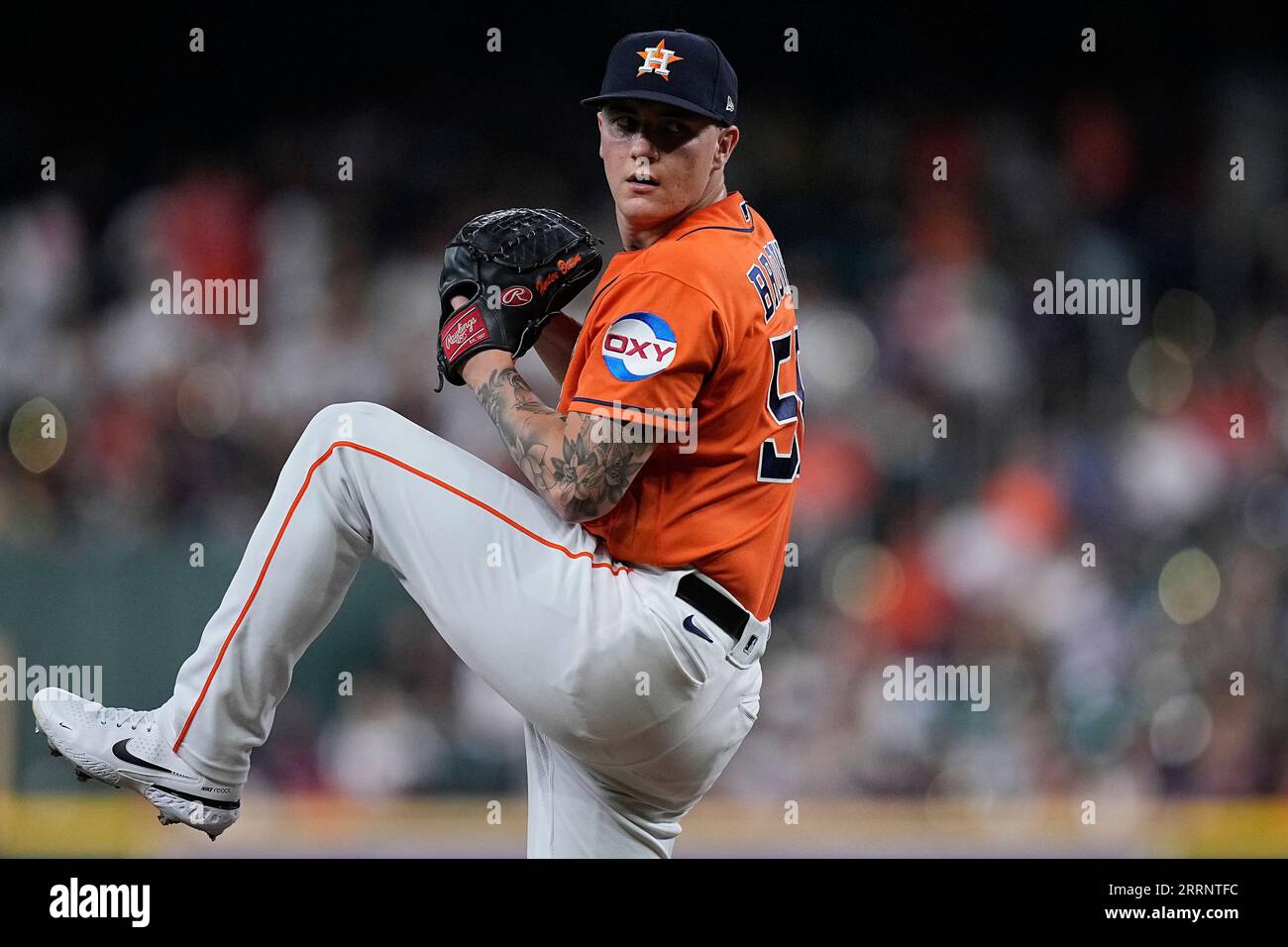 Houston Astros starting pitcher Hunter Brown winds up during the first ...