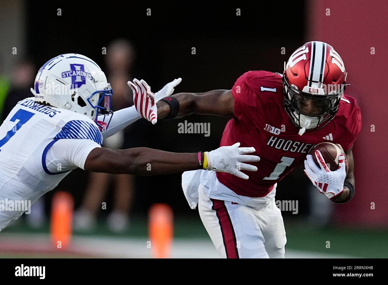Indiana wide receiver Donaven McCulley looks to fend off Indiana State ...