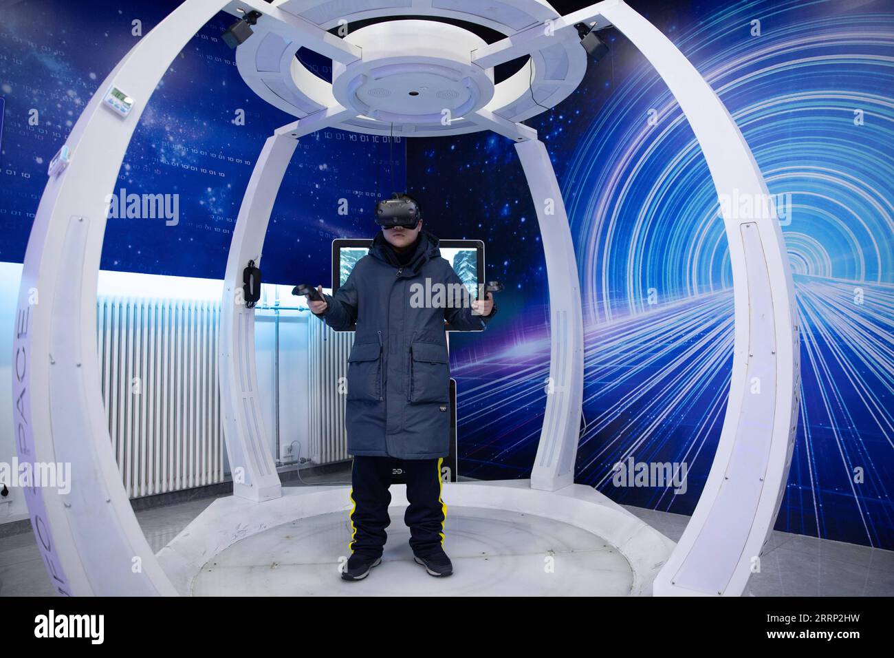 230213 -- HARBIN, Feb. 13, 2023 -- A visitor tries VR devices to ...