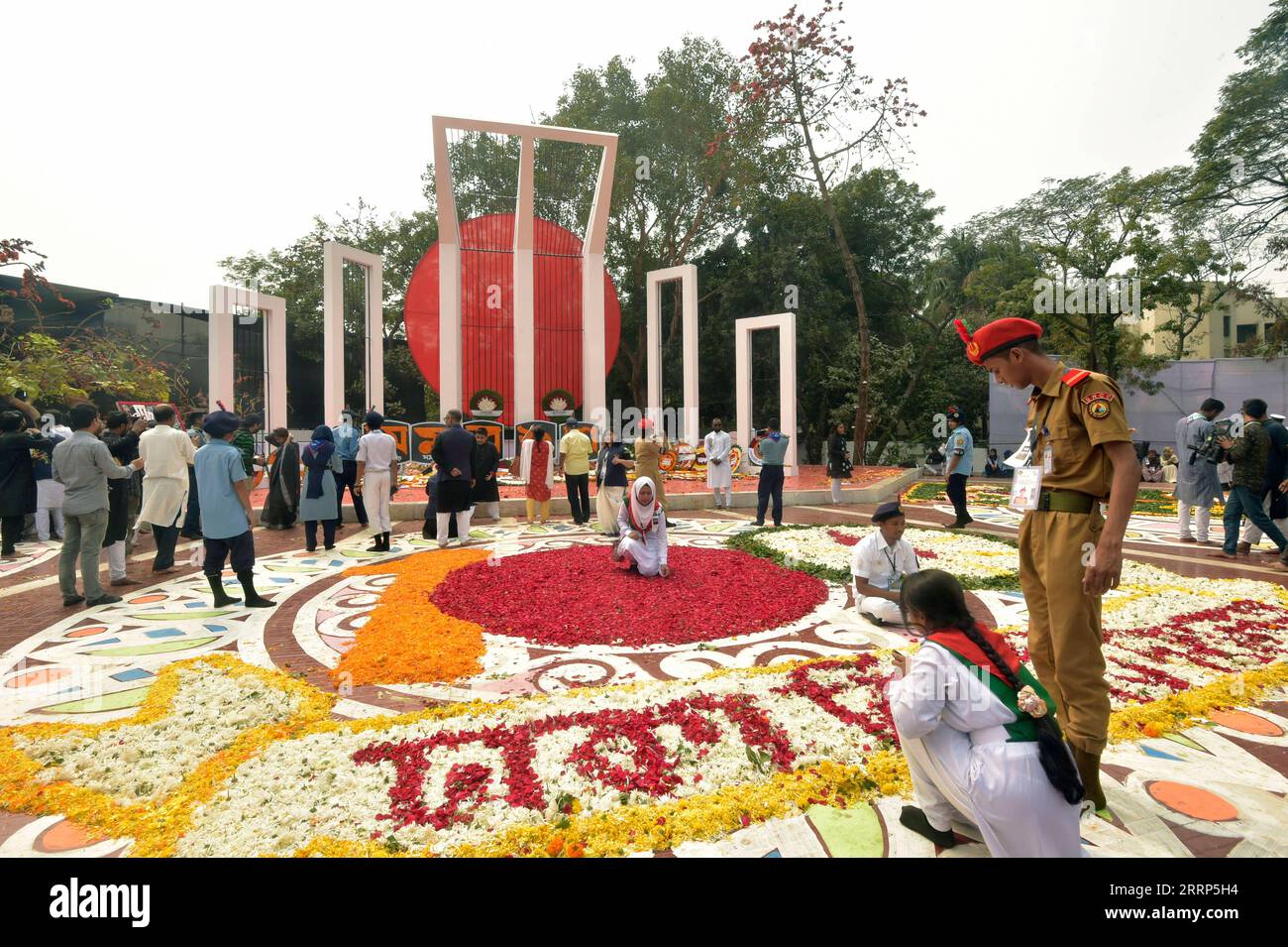 230221 -- DHAKA, Feb. 21, 2023 -- Volunteers decorate the Central Shaheed Minar, a solemn and ...