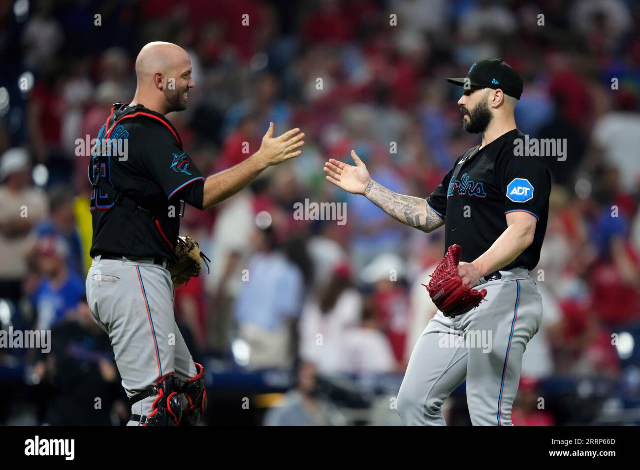 Miami Marlins' Jacob Stallings, left, and Tanner Scott celebrate after ...