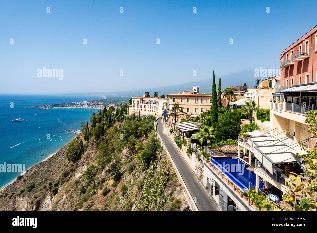 Hotel building in Taormina with accommodation for tourists on a hill ...