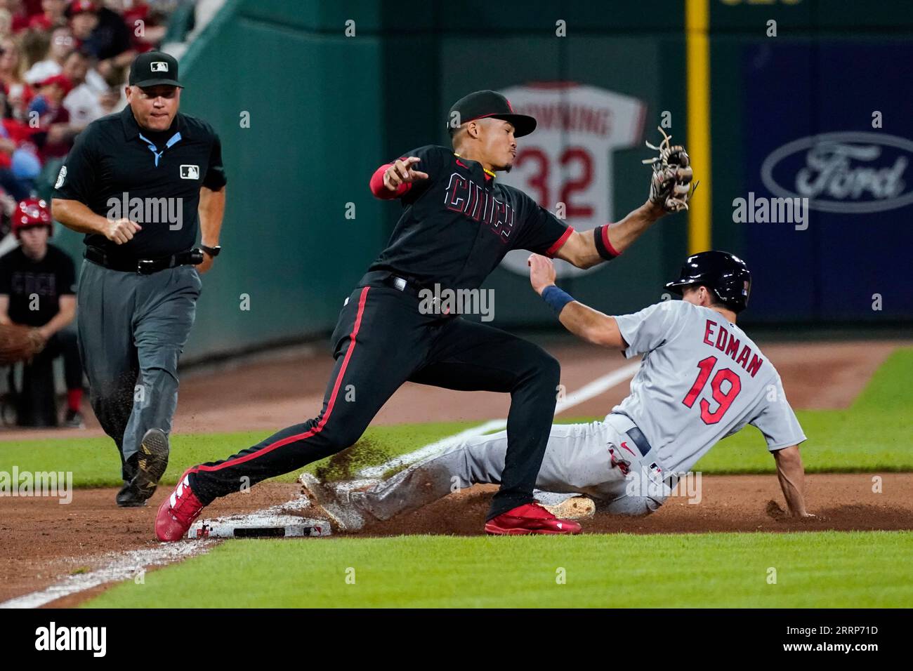 St. Louis Cardinals' Tommy Edman, right, slides into third base on a ...
