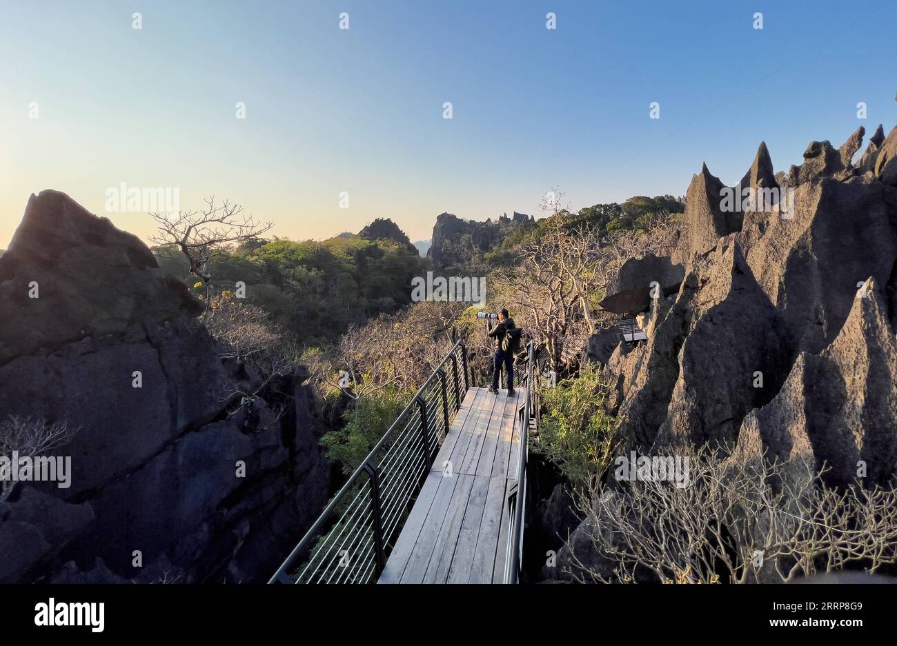 230303 -- KHAMMOUANE, March 3, 2023 -- A tourist takes pictures at the ...