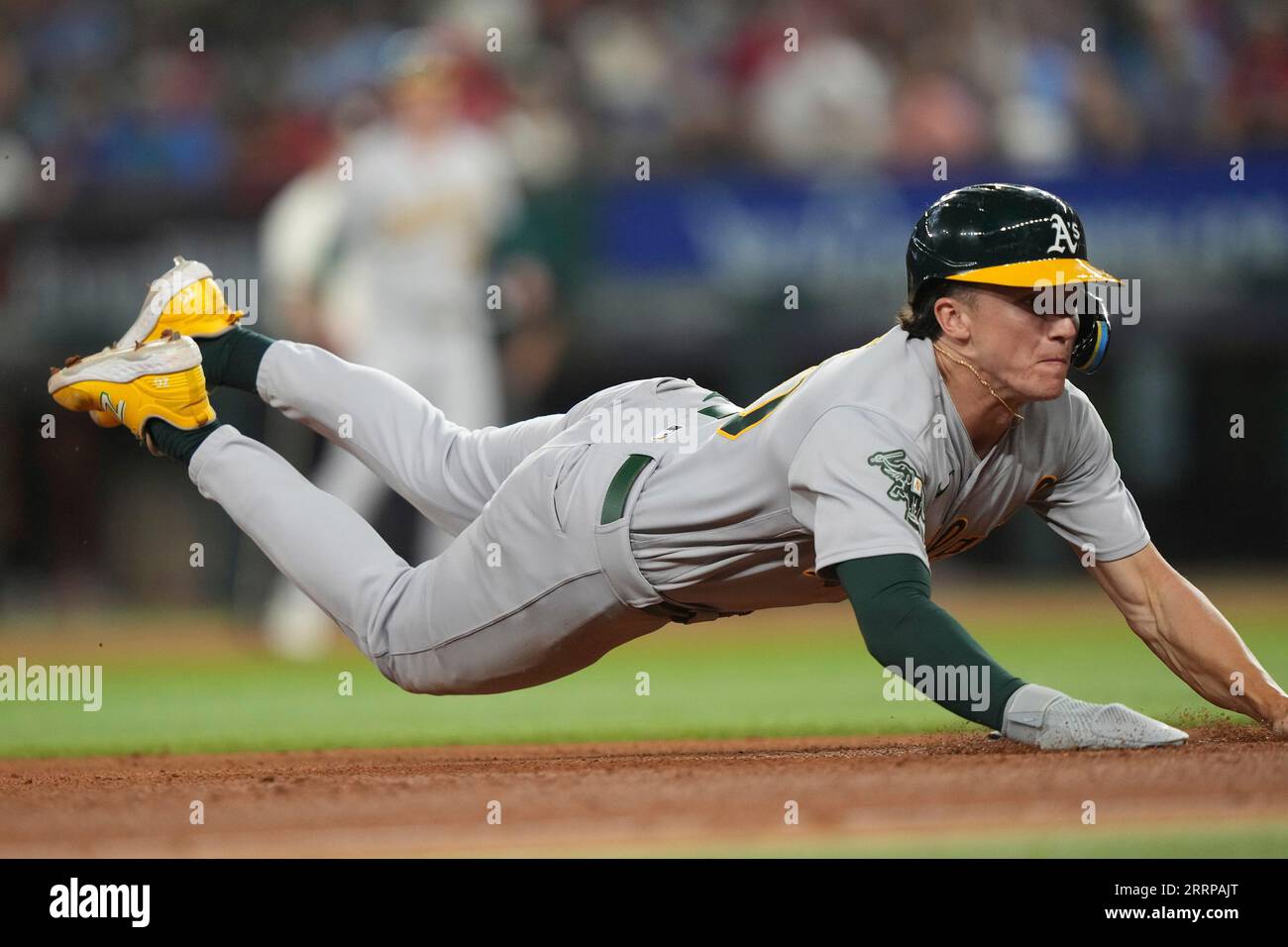 Oakland Athletics' Zack Gelof slides into third base on a steal-attempt ...