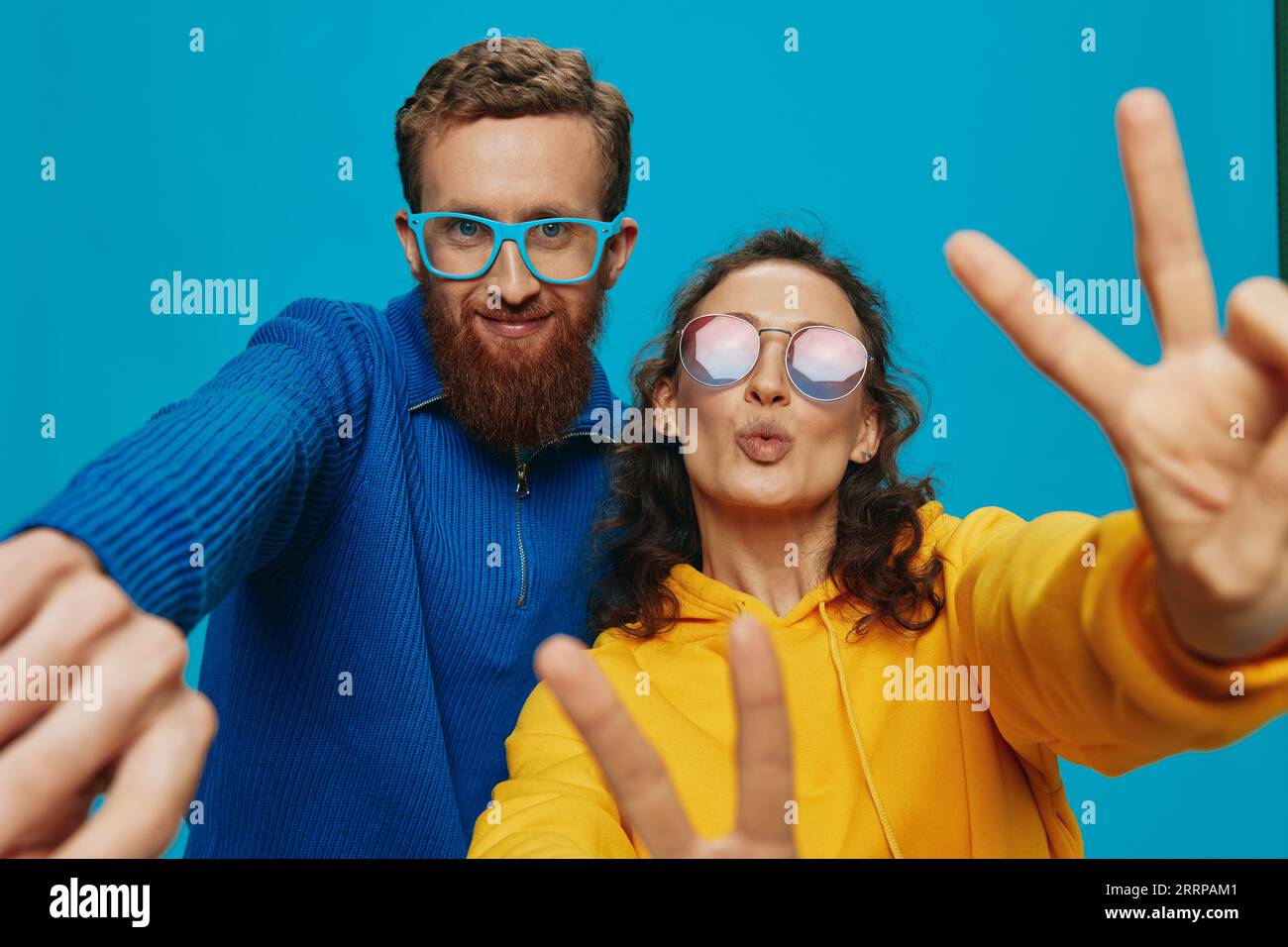 A woman and a man fun couple cranking and showing signs with their ...