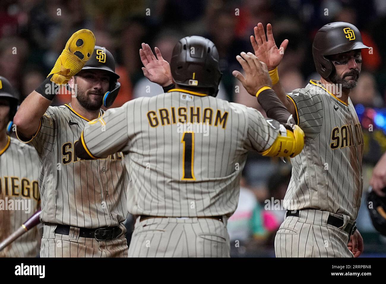 San Diego Padres' Trent Grisham (1) celebrates with Matthew Batten and ...