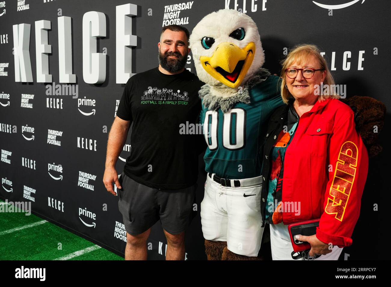 Jason Kelce poses for a photo with Donna Kelce at the "Kelce ...