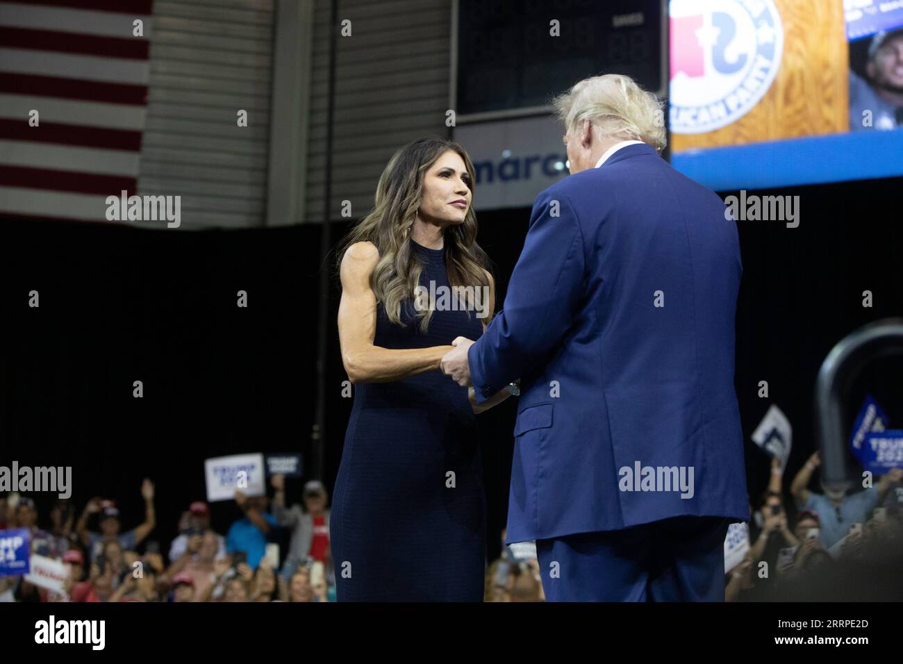 Former President Donald Trump greets South Dakota Gov. Kristi Noem at ...