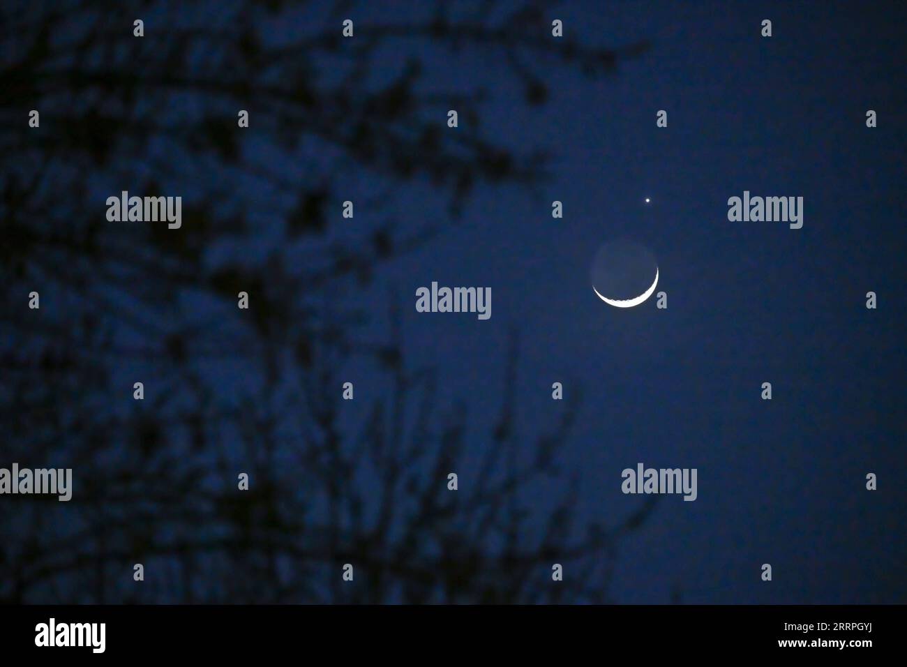 230324 -- BEIJING, March 24, 2023 -- The planet Venus and the crescent ...