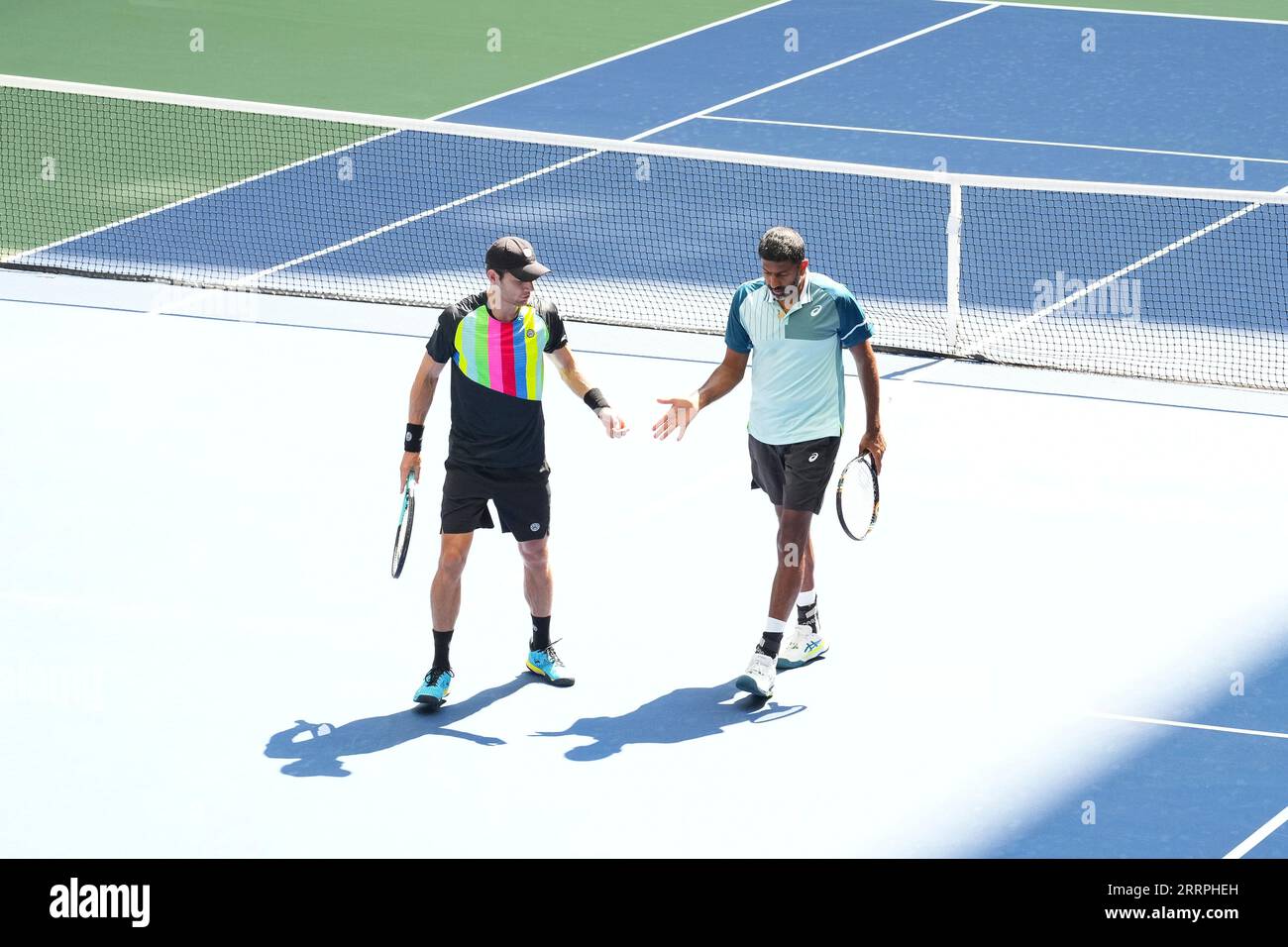 Rohan Bopanna and Matthew Ebden high five during a men's doubles ...
