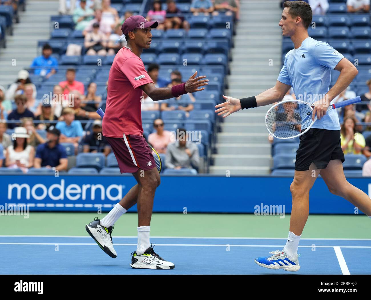 Rajeev Ram and Joe Salisbury high five during a men's doubles ...