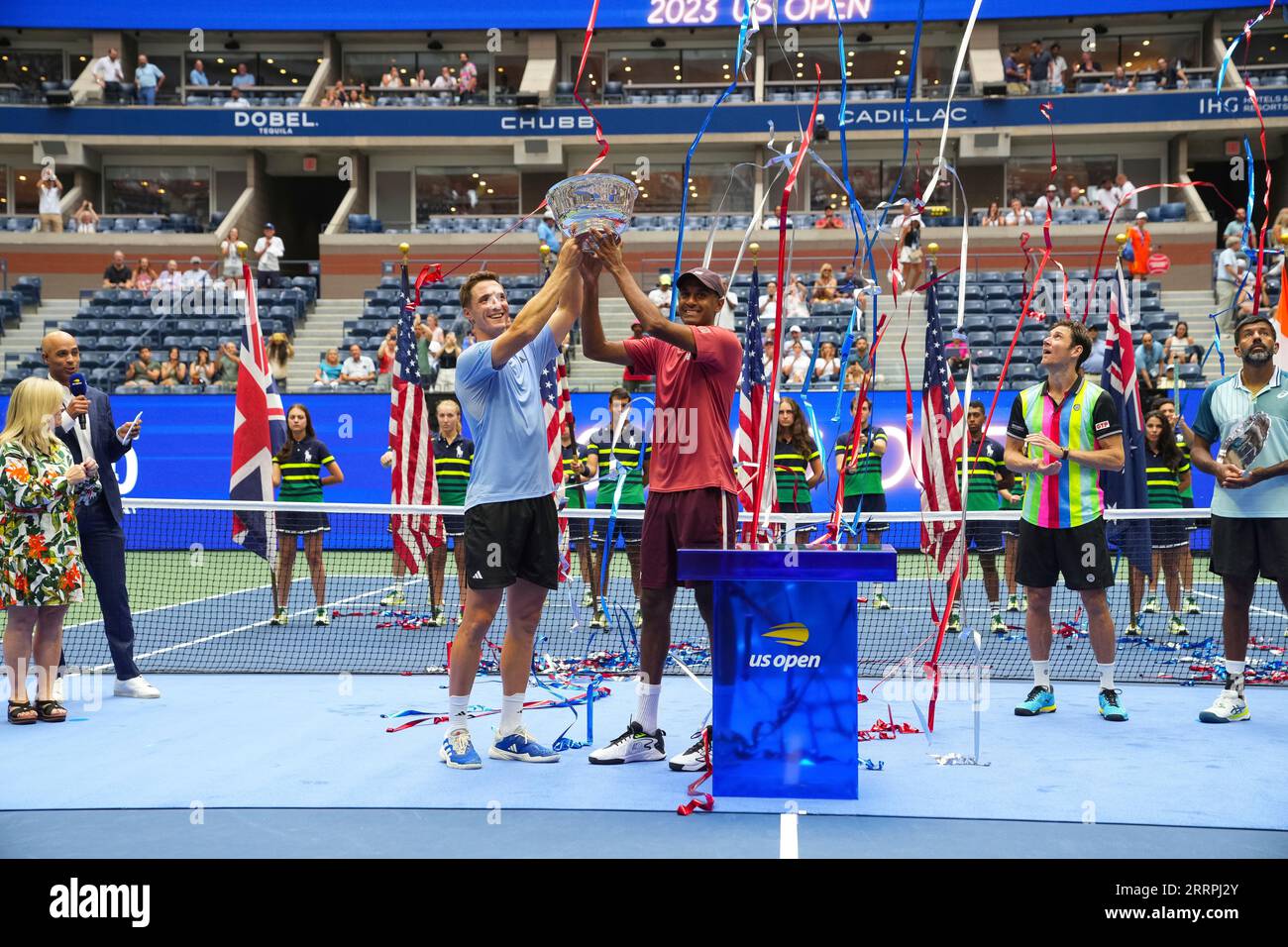 Joe Salisbury and Rajeev Ram lift the trophy during Men's Doubles ...