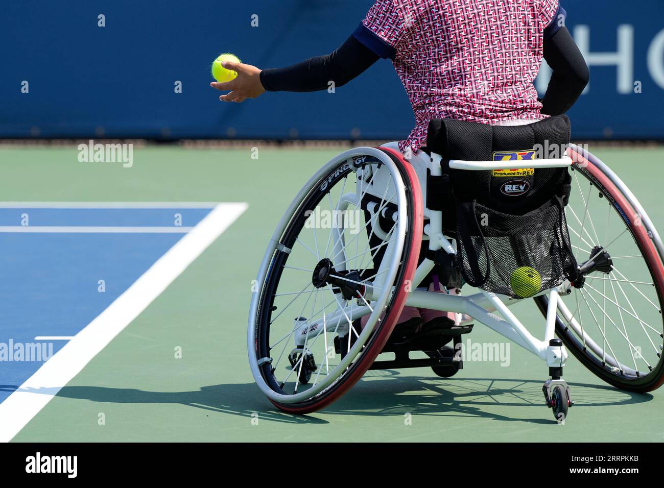 Rio Okano serves during a junior wheelchair girls' singles semifinal ...
