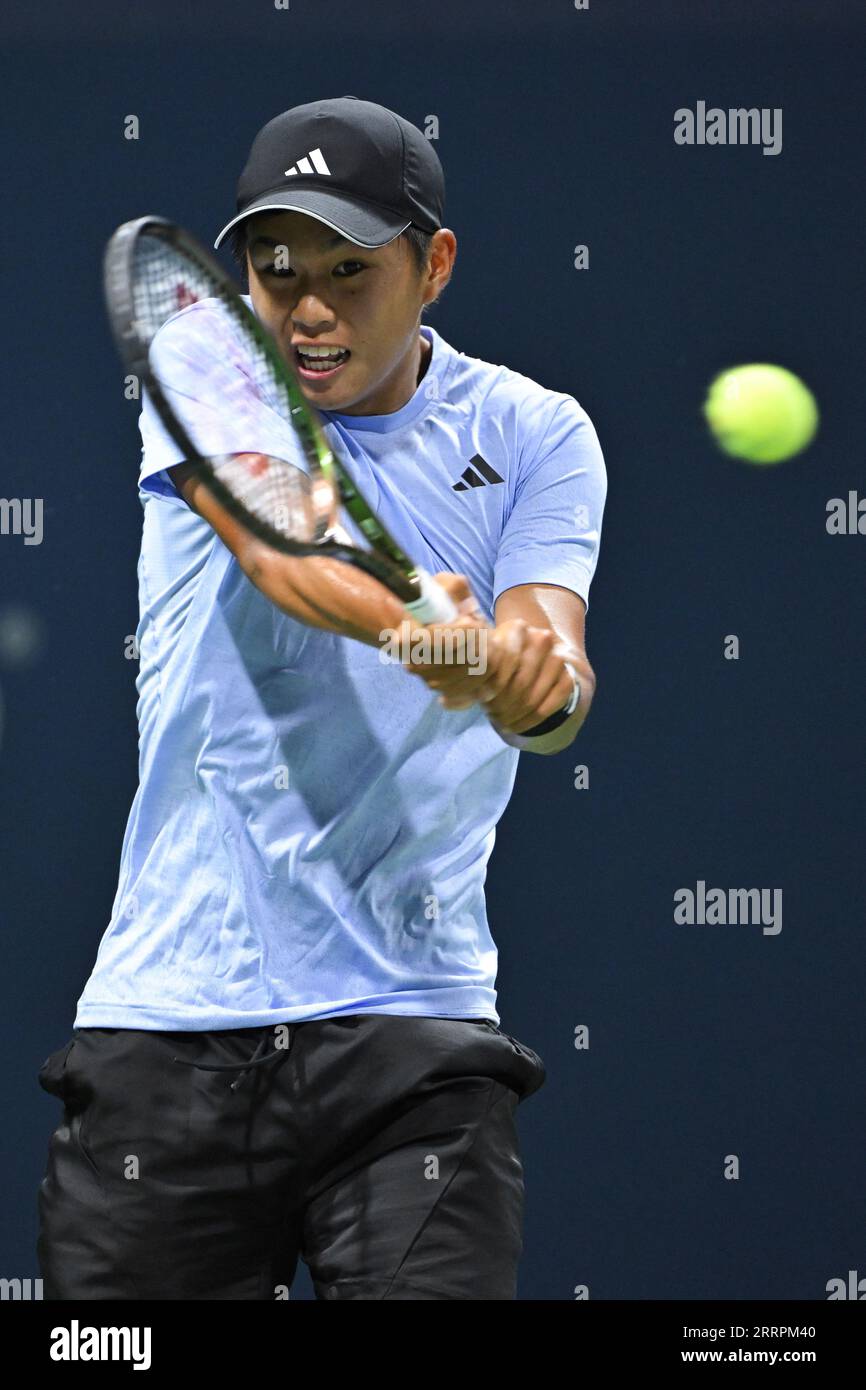 Learner Tien in action during a junior boys' singles semifinal match at ...