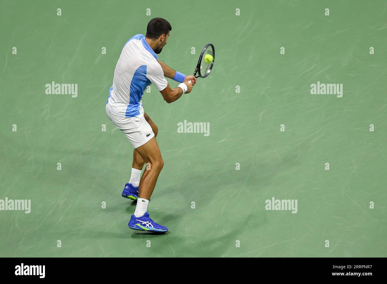 Novak Djokovic hits a backhand during a men's singles semifinal match ...
