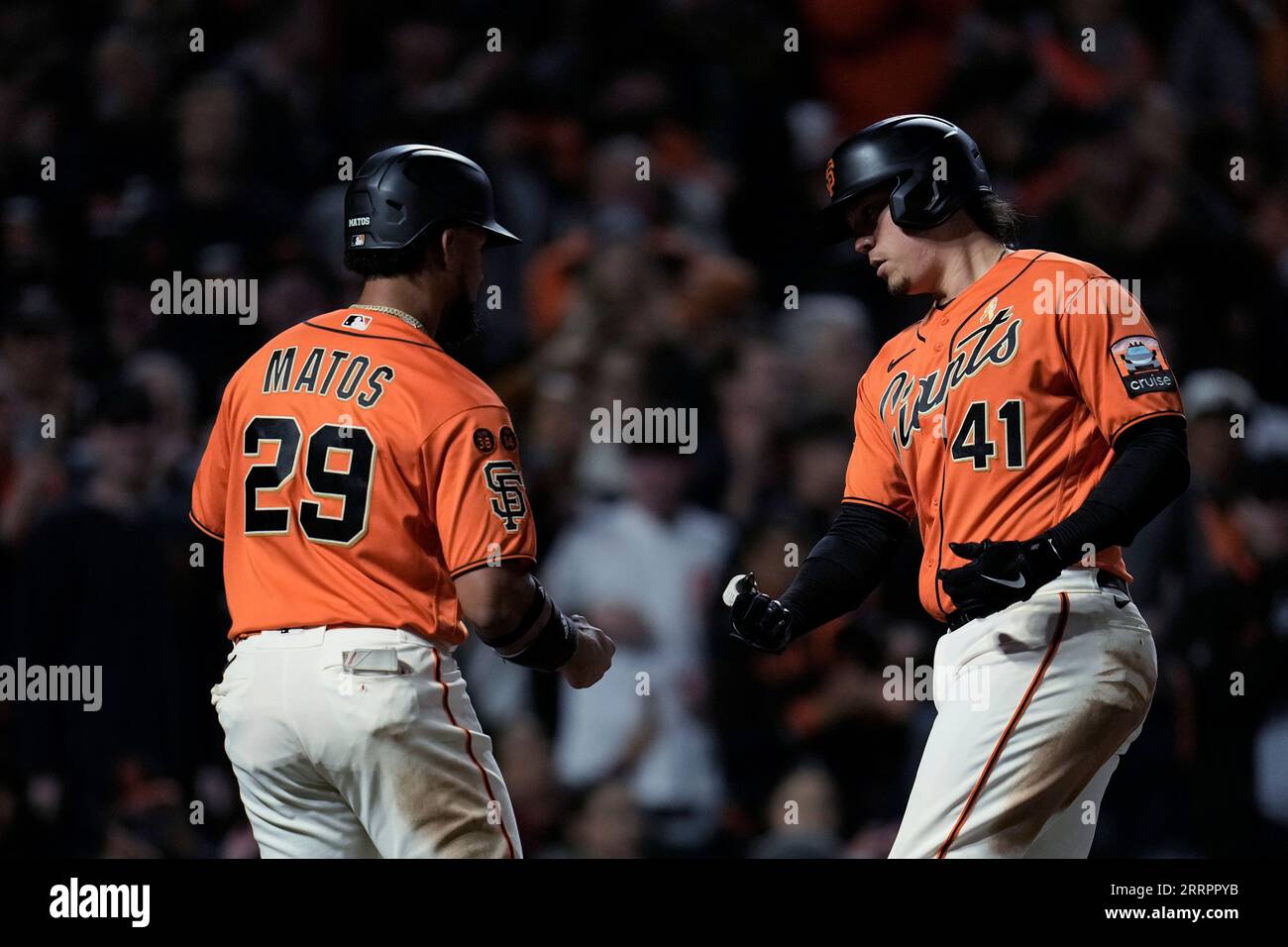 San Francisco Giants' Wilmer Flores, right, celebrates with Luis Matos ...