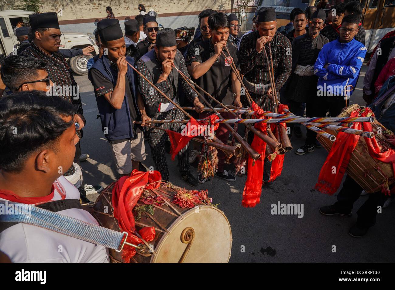 230410 -- KATHMANDU, April 10, 2023 -- Newar men in traditional attire ...