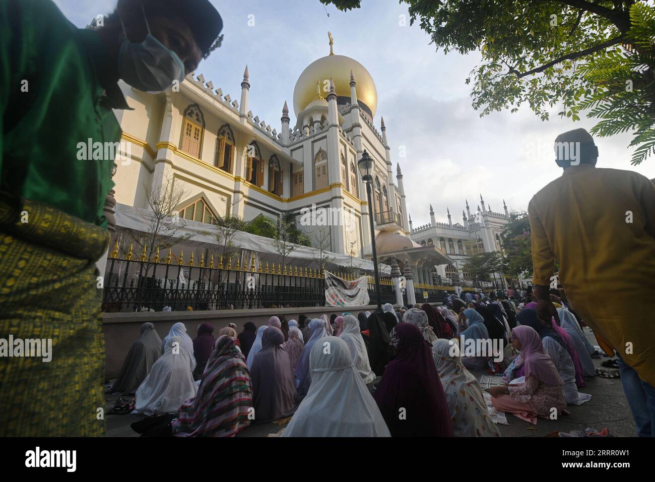 230422 -- SINGAPORE, April 22, 2023 -- Muslims offer Eid al-Fitr prayers at Sultan Mosque in ...