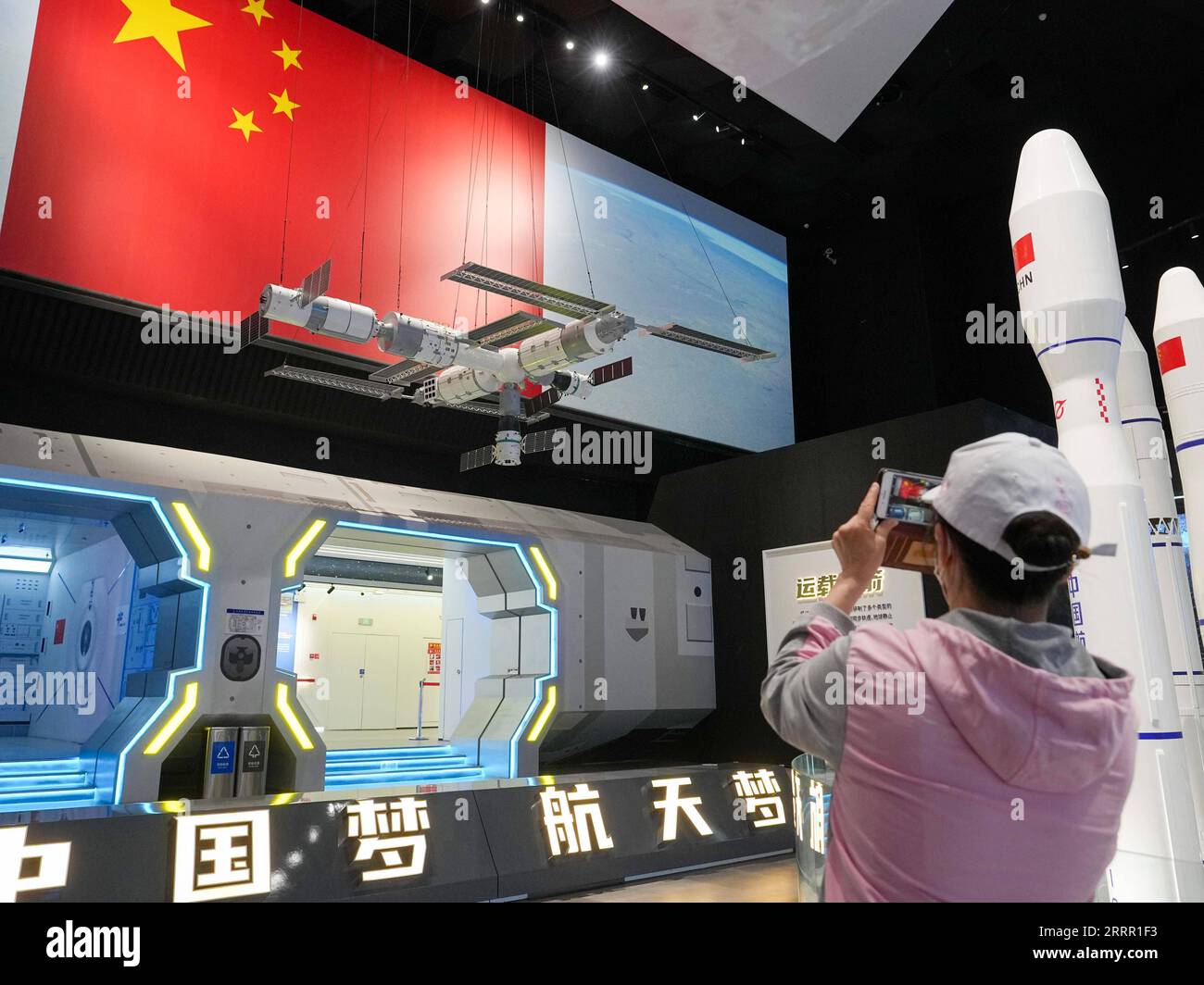 230424 -- BEIJING, April 24, 2023 -- A visitor takes photos of a model ...