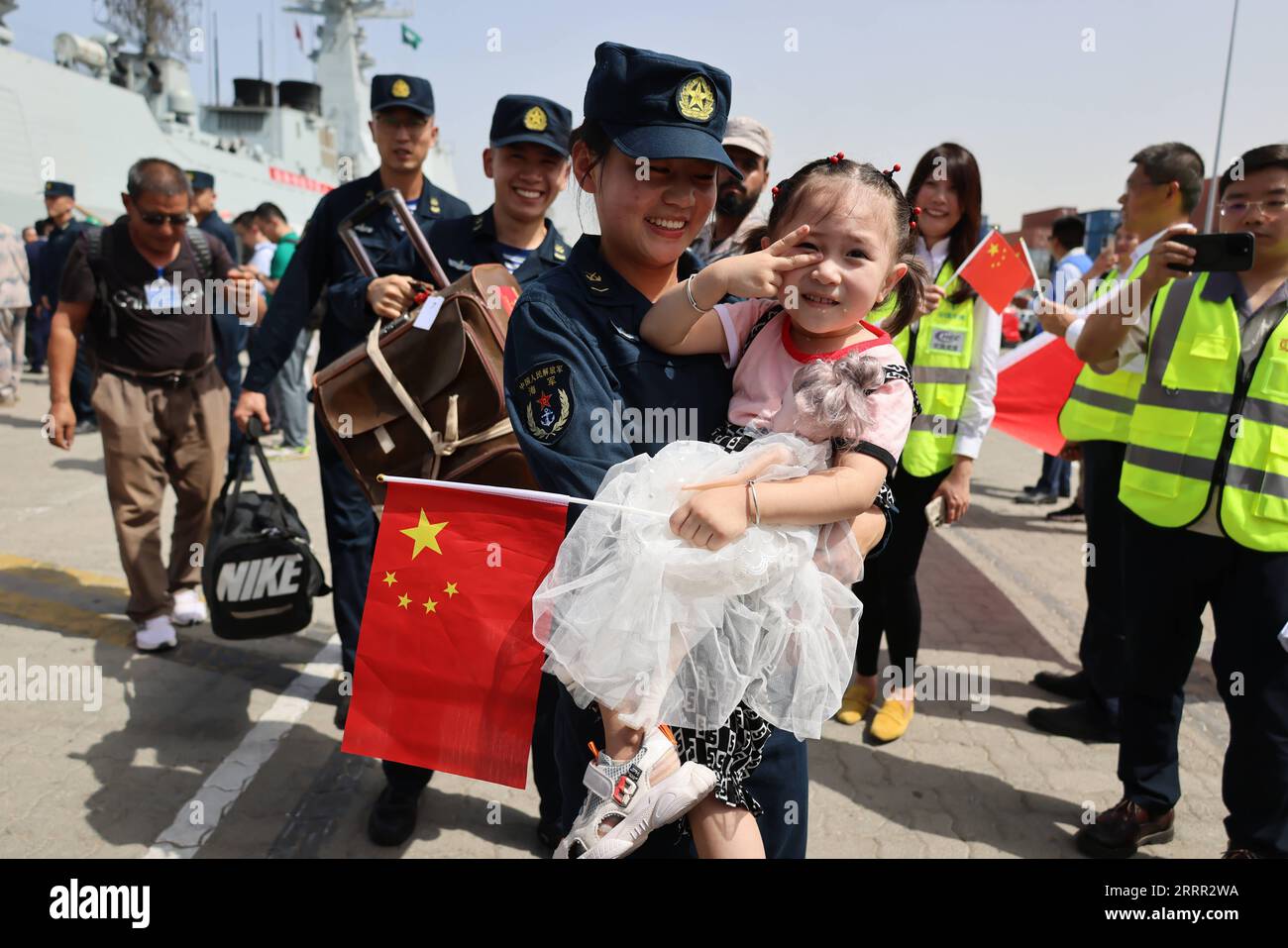 230428 -- JEDDAH, April 28, 2023 -- A Chinese navy soldier escorting a child evacuated from ...