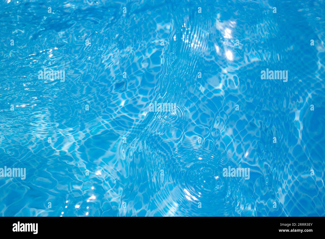 pool water ripples with sunlight glittery reflections, close up Stock ...