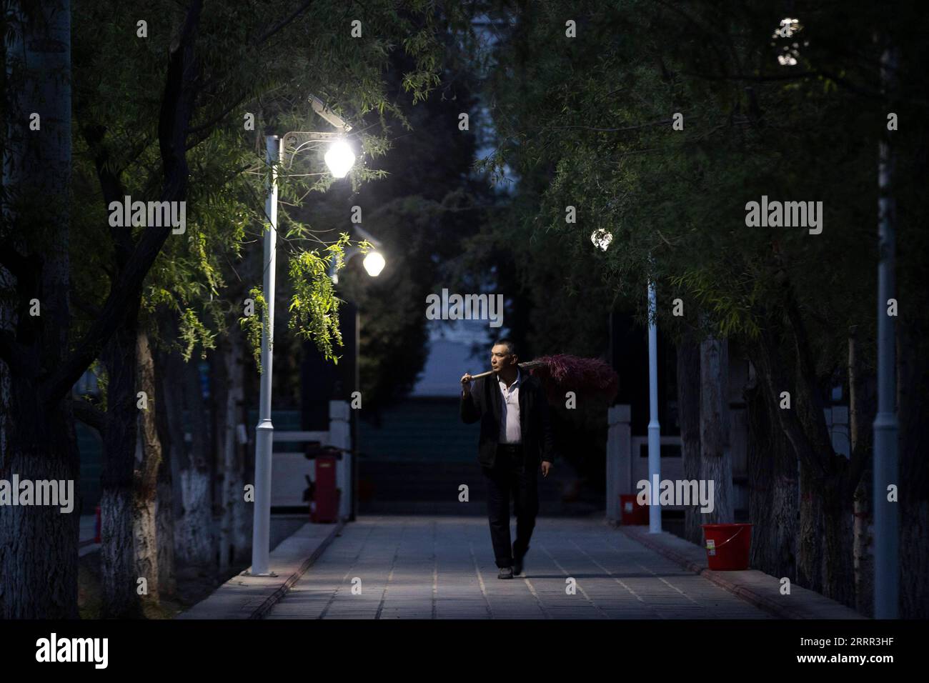 230430 -- YECHENG, April 30, 2023 -- Eniwar Emer walks in Yecheng ...