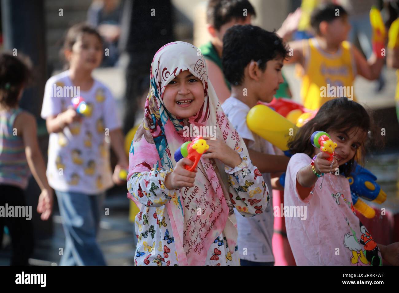 Tehran, Iran. 8th Sep, 2023. Children play with water guns as they take ...