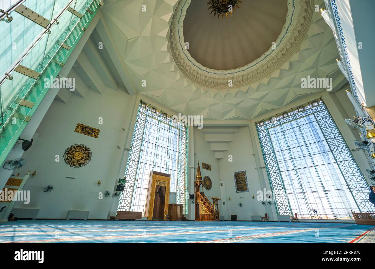 Day interior view of the main prayer hall with large, natural light ...