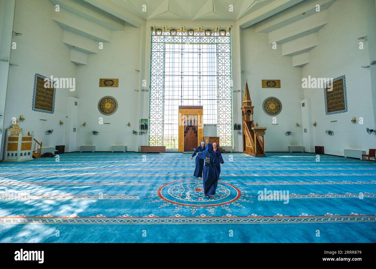 Day interior view of the main prayer hall with large, natural light ...