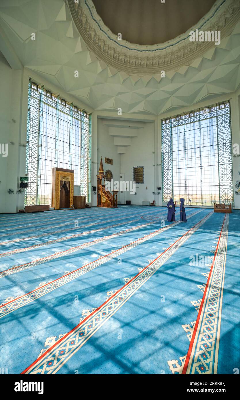 Day interior view of the main prayer hall with large, natural light ...