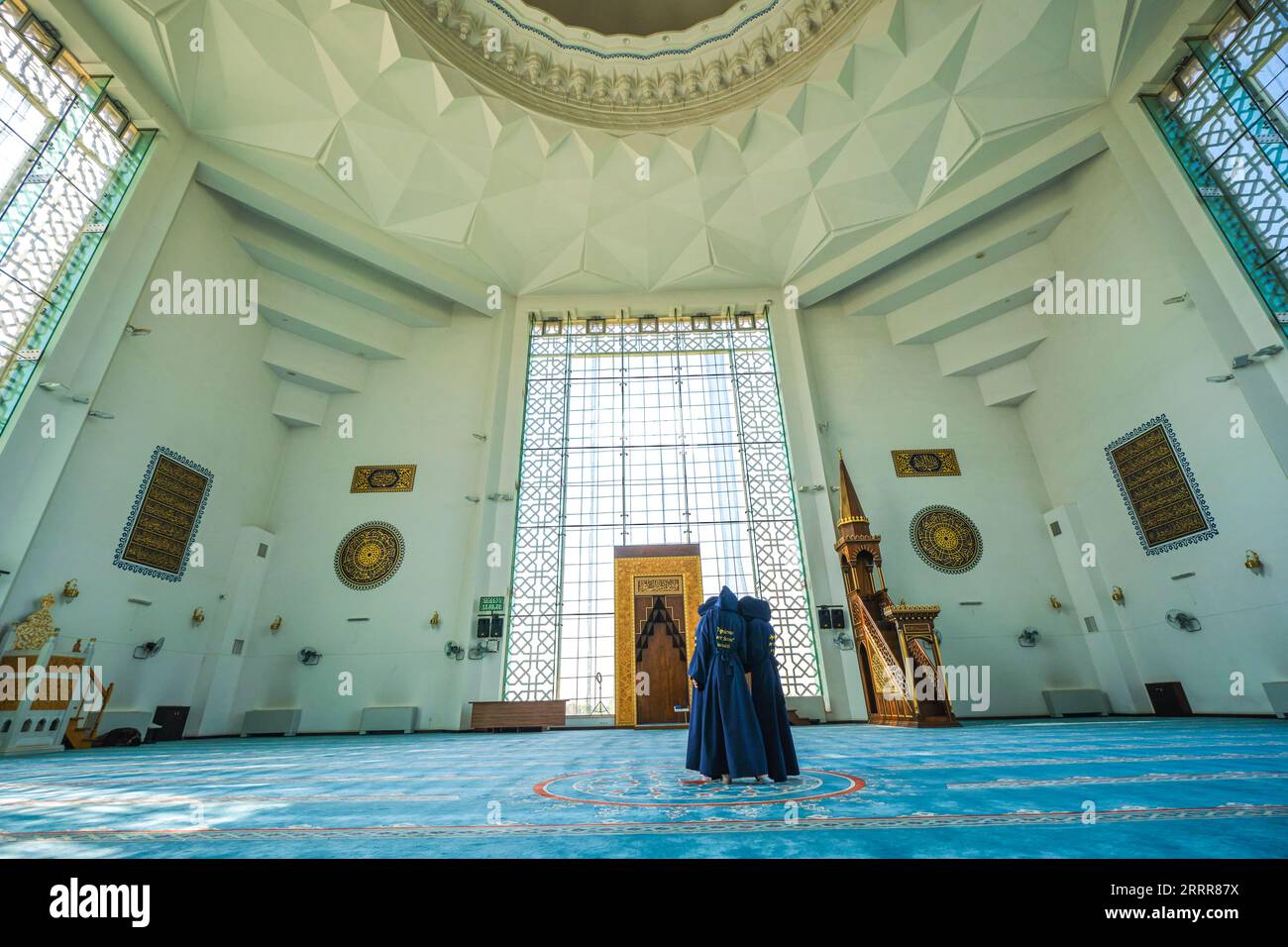 Day interior view of the main prayer hall with large, natural light ...