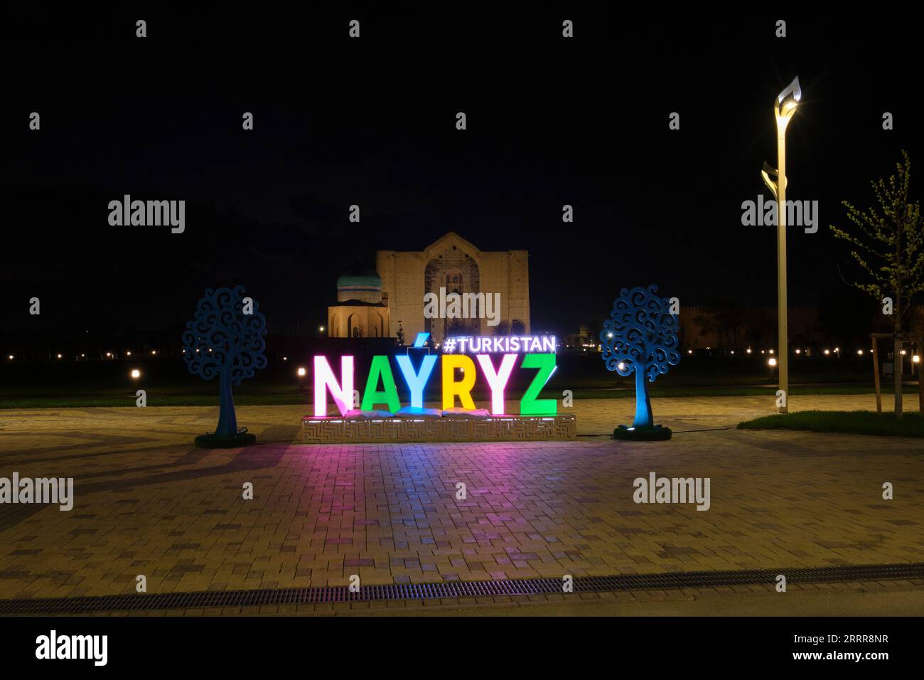 Night time view of the Mausoleum of Khoja Ahmed Yasawi with a happy ...