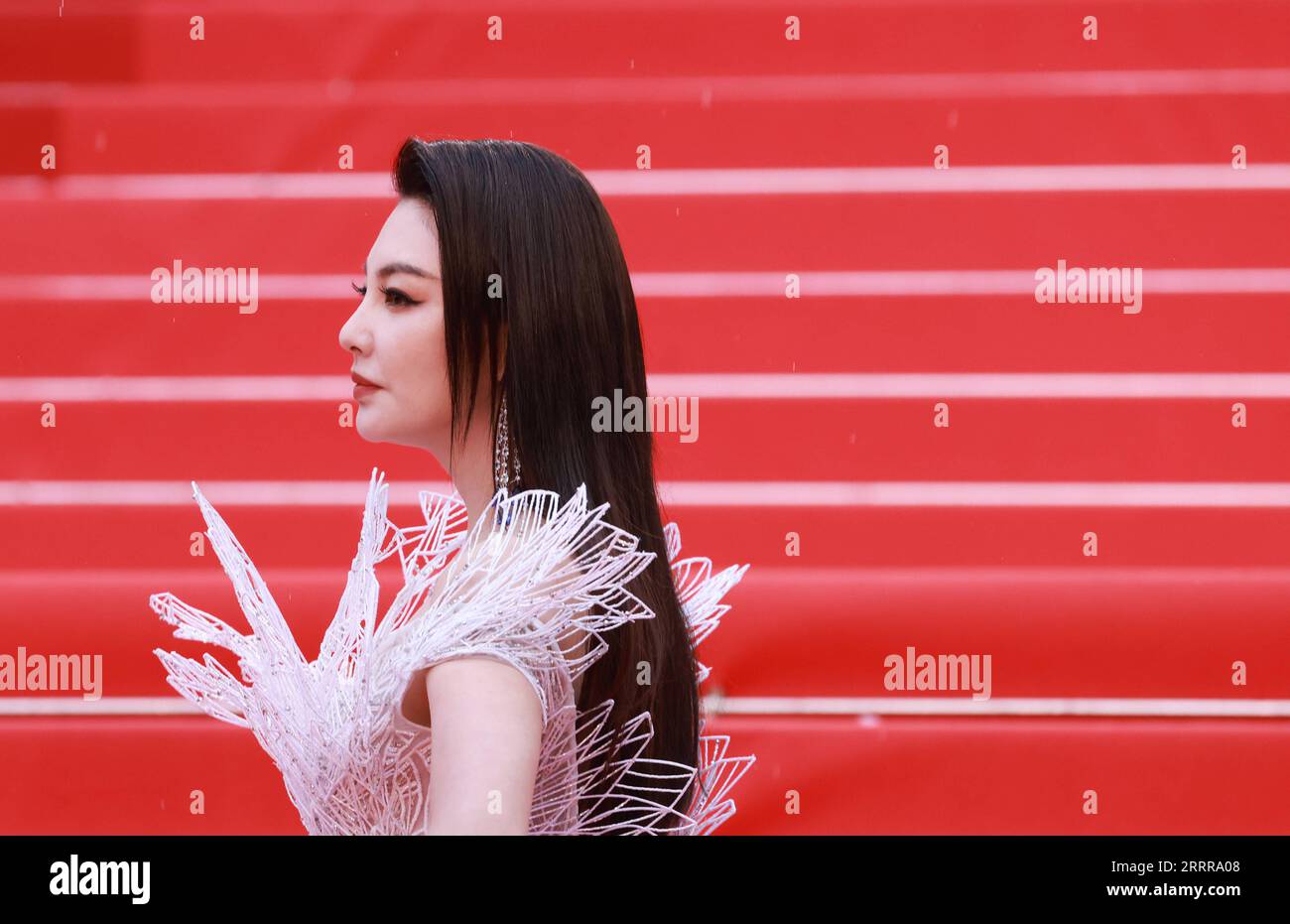 230518 -- CANNES, May 18, 2023 -- Actress Zhang Yuqi poses as she arrives for the screening of ...