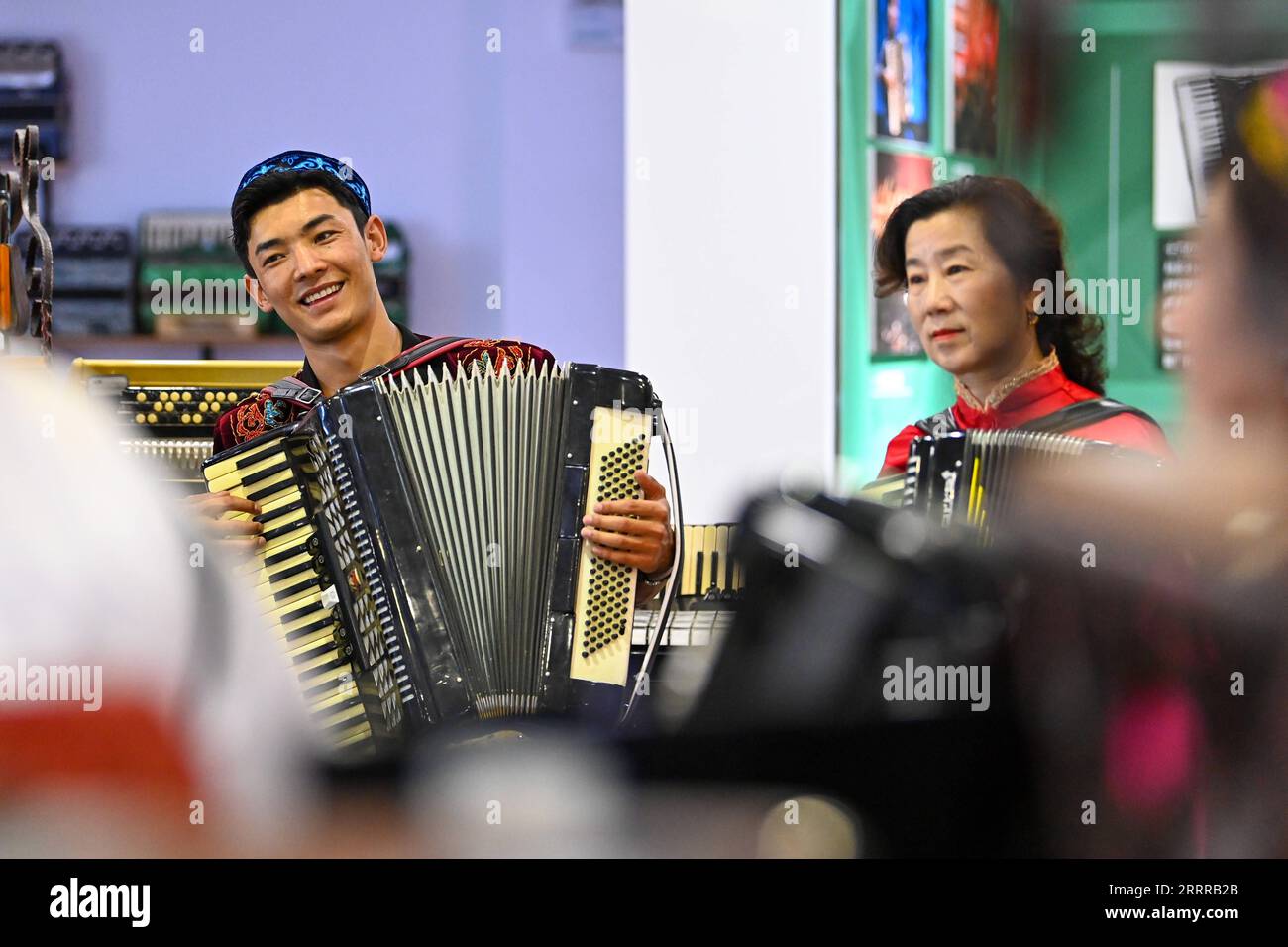 230520 -- ILI, May 20, 2023 -- An accordion band plays for visitors on ...